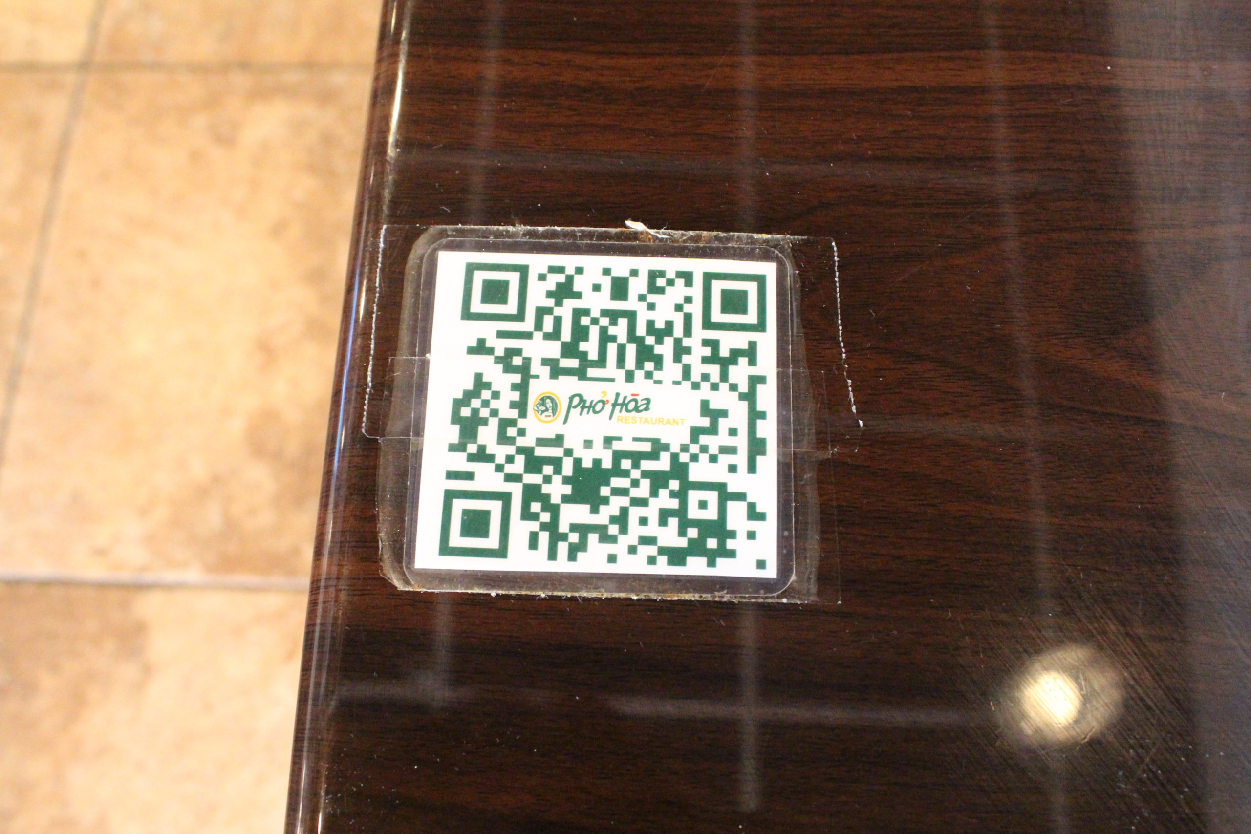 Barcodes on each dining table to access the Pho Hoa menu. Photo by ...